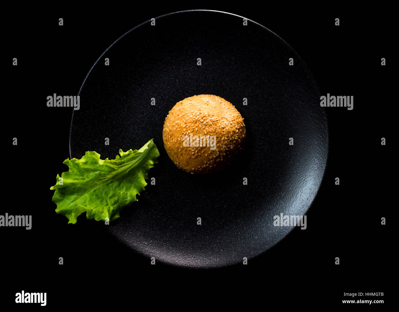 One Green Leaf Of Lettuce Near Burger Stock Photo - Alamy