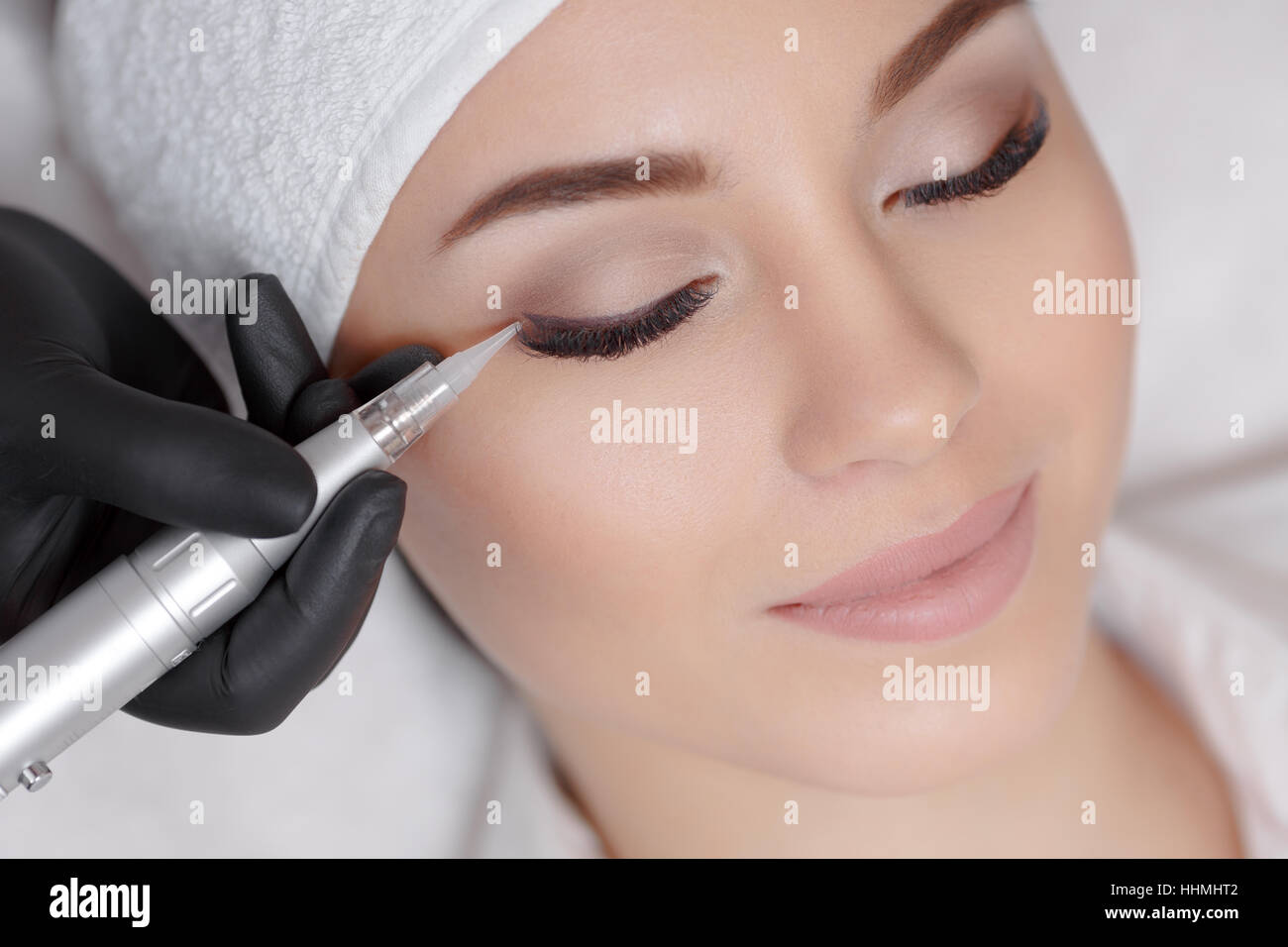 Permanent up procedure cosmetologist making hi-res stock photography ...