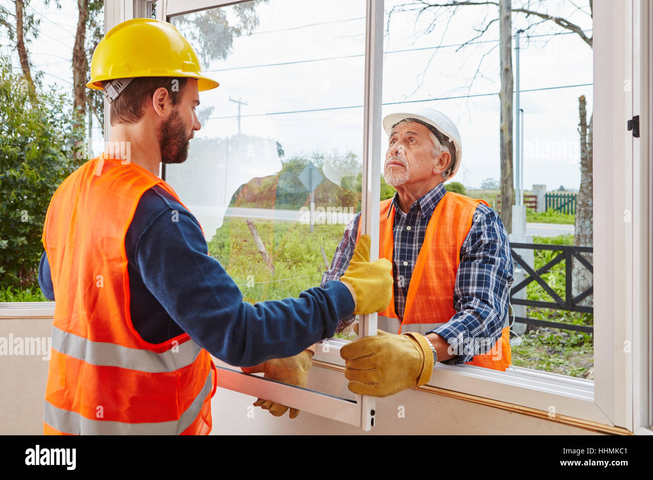 Modernization and mount of new window for woodhouse Stock Photo - Alamy