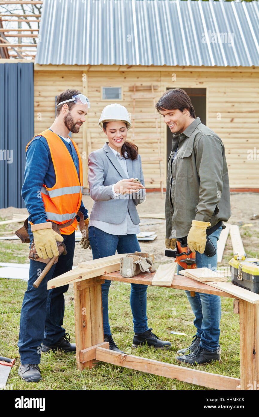 Building construction team with architect and craftsmen planning Stock ...