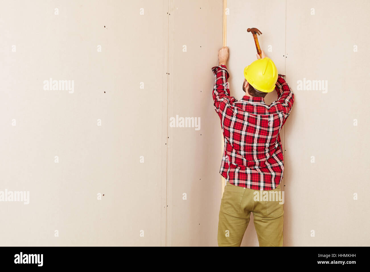 Carpenter during building construction renovation Stock Photo - Alamy