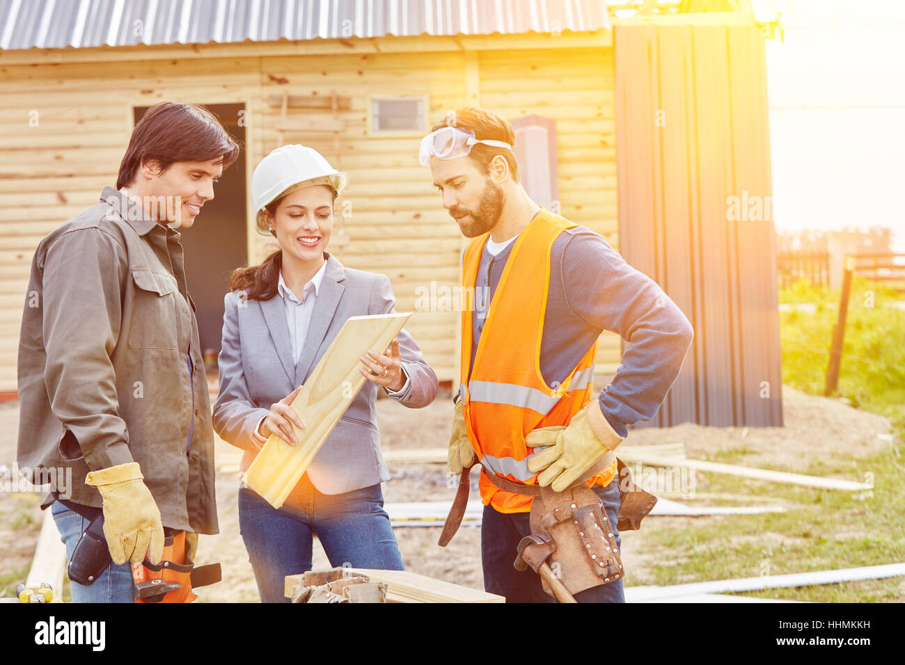 Teamwork between craftsman and artisans at construction site Stock ...