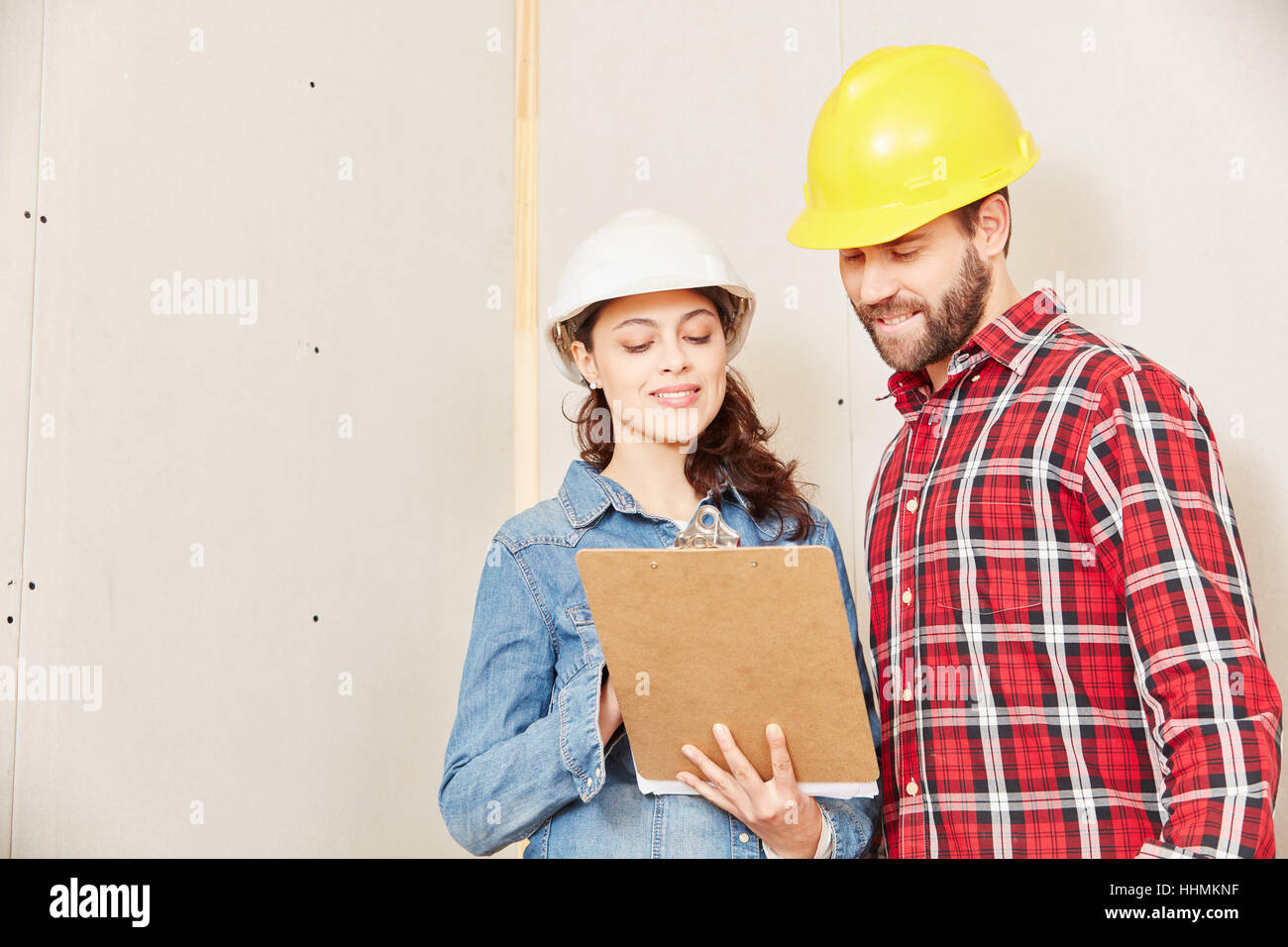 Architect and foreman working and planning with checklist Stock Photo ...