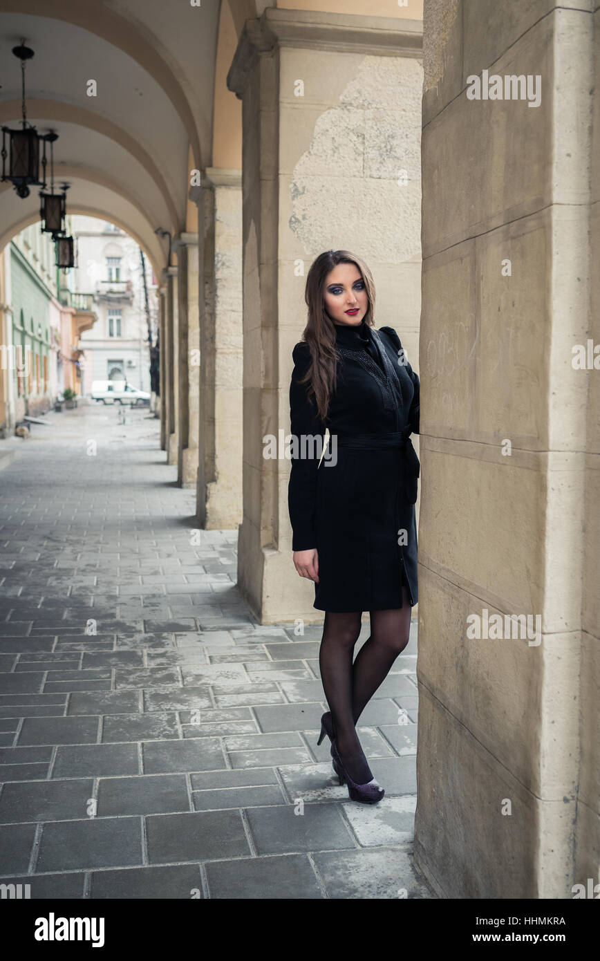 beautiful girl under the arch Stock Photo - Alamy
