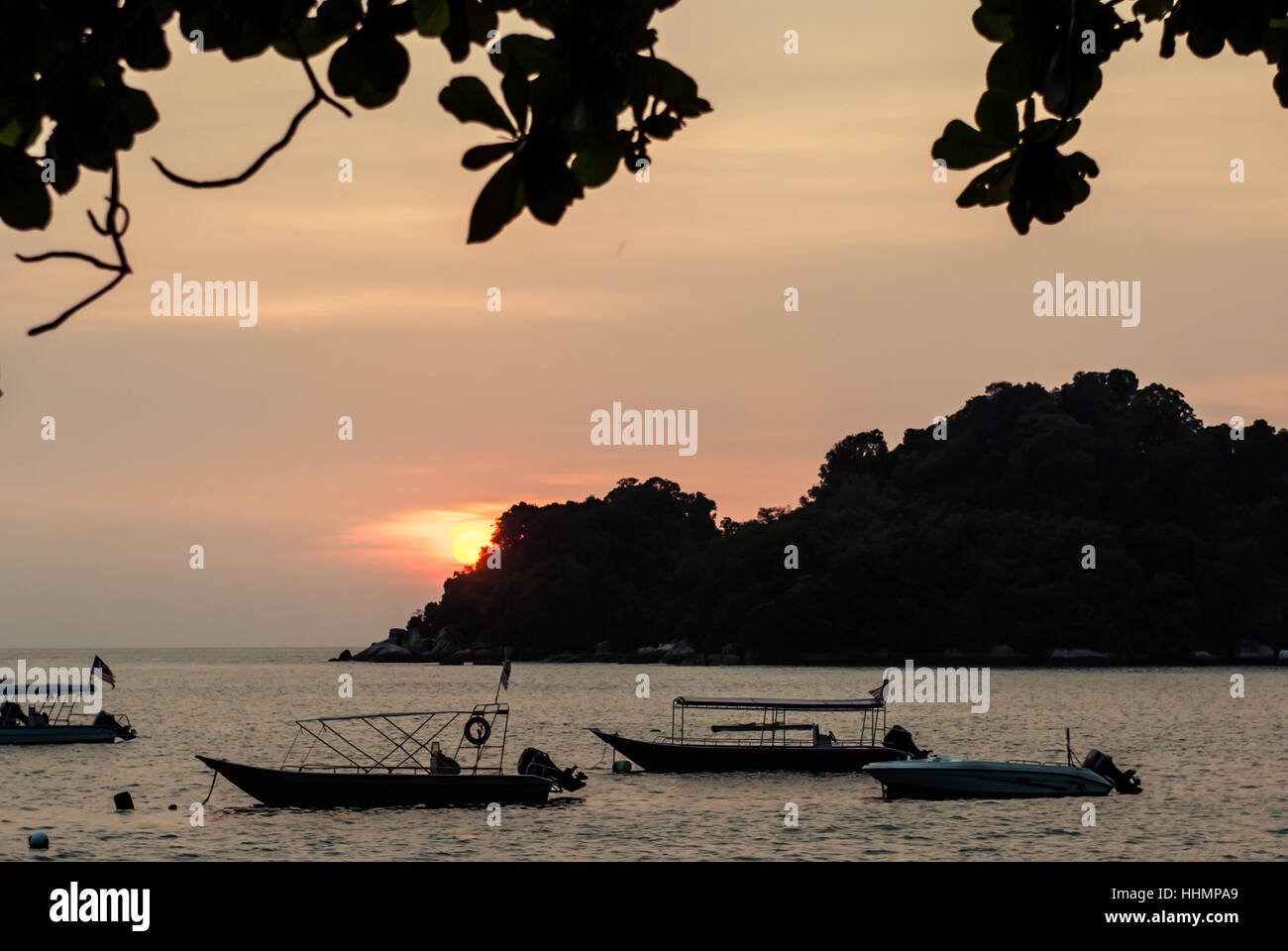 Sunset over ocean with island view Stock Photo - Alamy