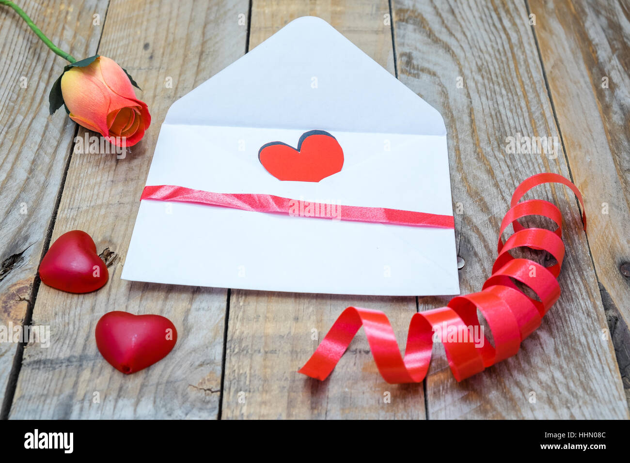 heart in a white envelope and a rose for Valentine's Day Stock Photo ...