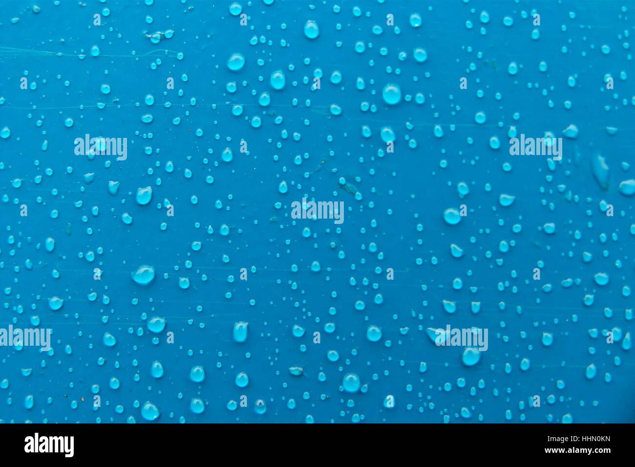 Many small droplets on blue surface Stock Photo - Alamy