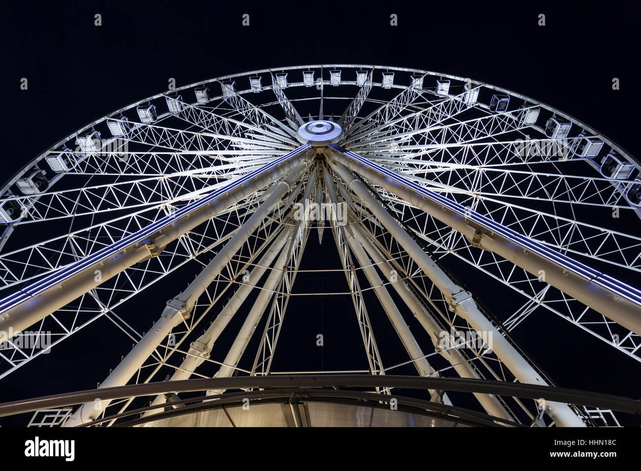The Liverpool Wheel, lit up in the late evening on the old dockside ...
