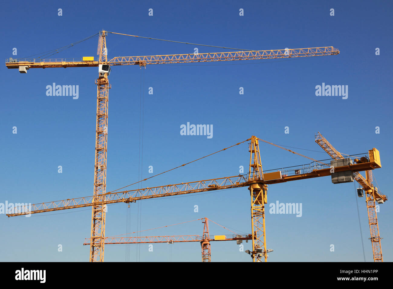 construction cranes at a construction site Stock Photo - Alamy