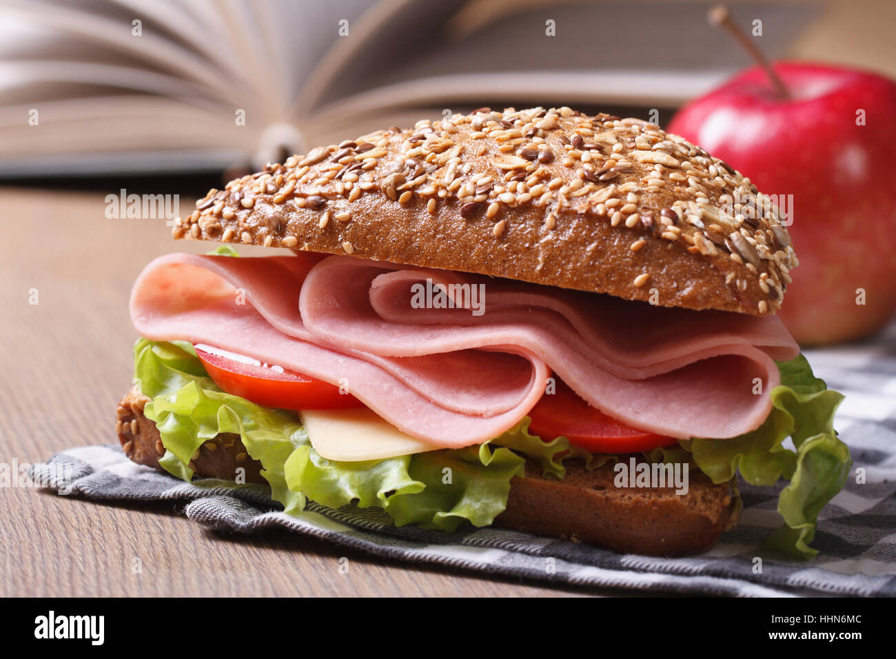 School lunch: a ham sandwich and apple closeup. horizontal Stock Photo ...
