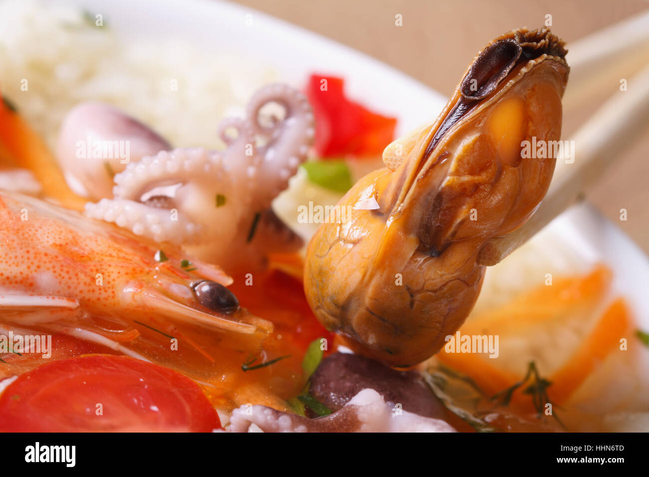 Mussel without shell close up in Asian soup from seafood with ...