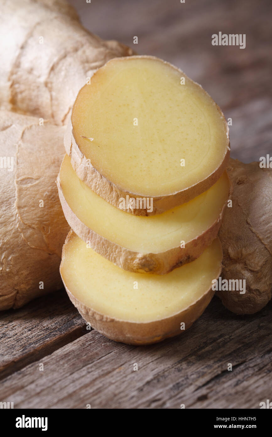 Sliced ginger root rings close-up on the table. vertical Stock Photo ...