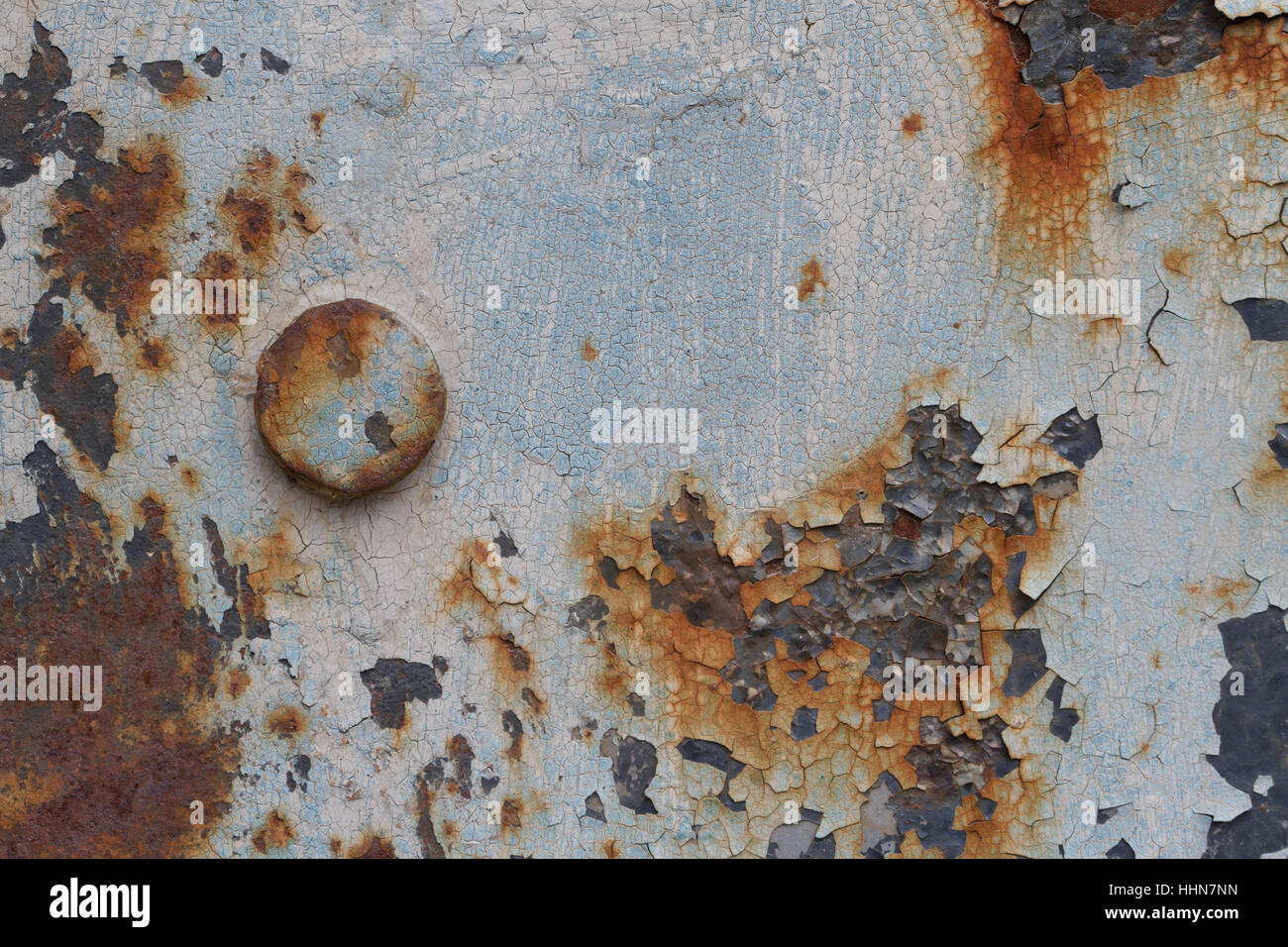 Texture of rusty metal surface with cracked paint and a large bolt ...