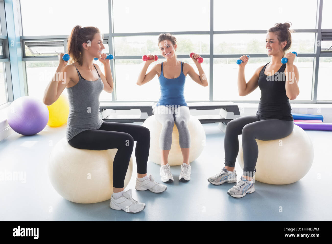 Trainer spotting woman lifting weights hi-res stock photography and ...