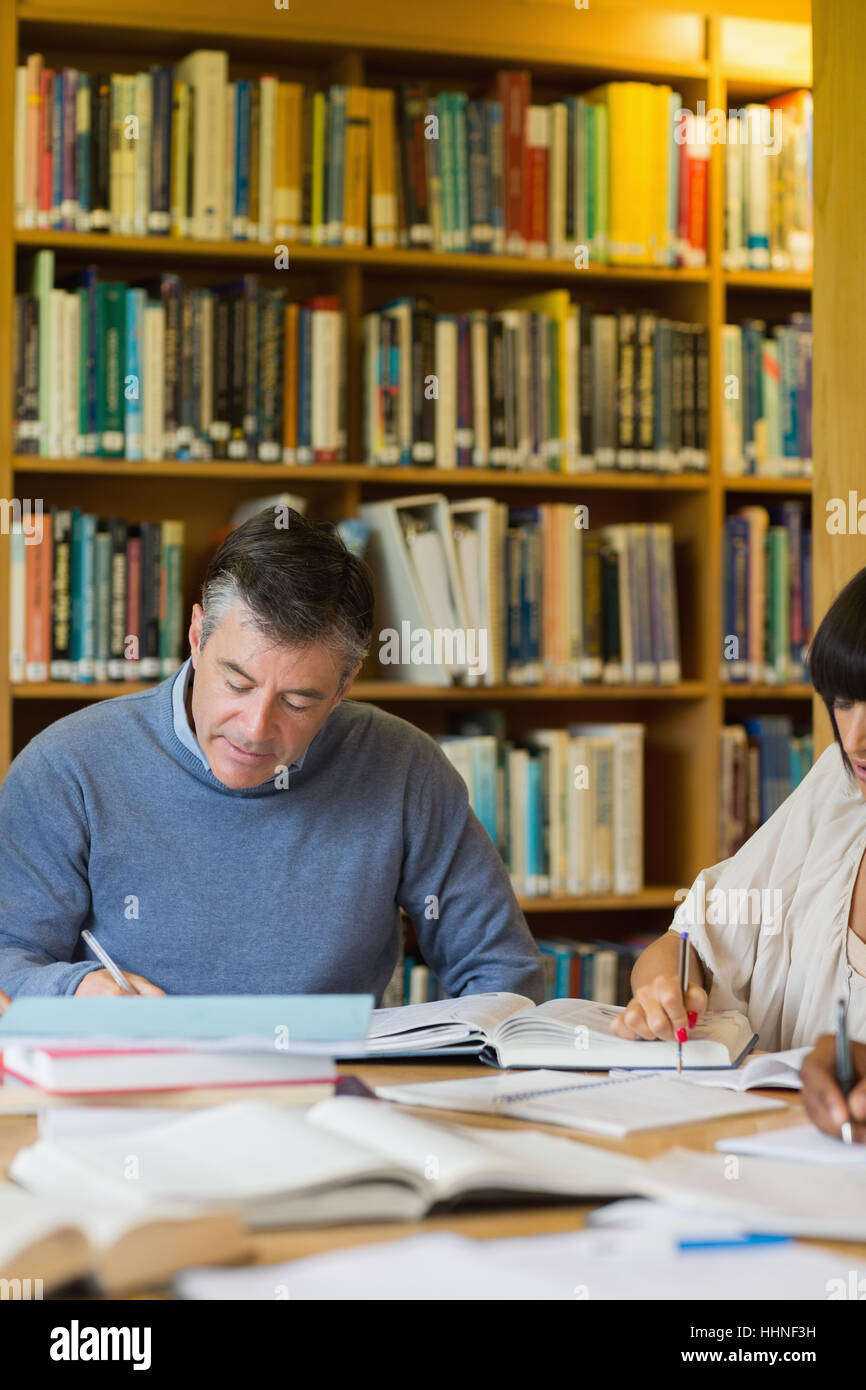 Mature students library desk hi-res stock photography and images - Alamy