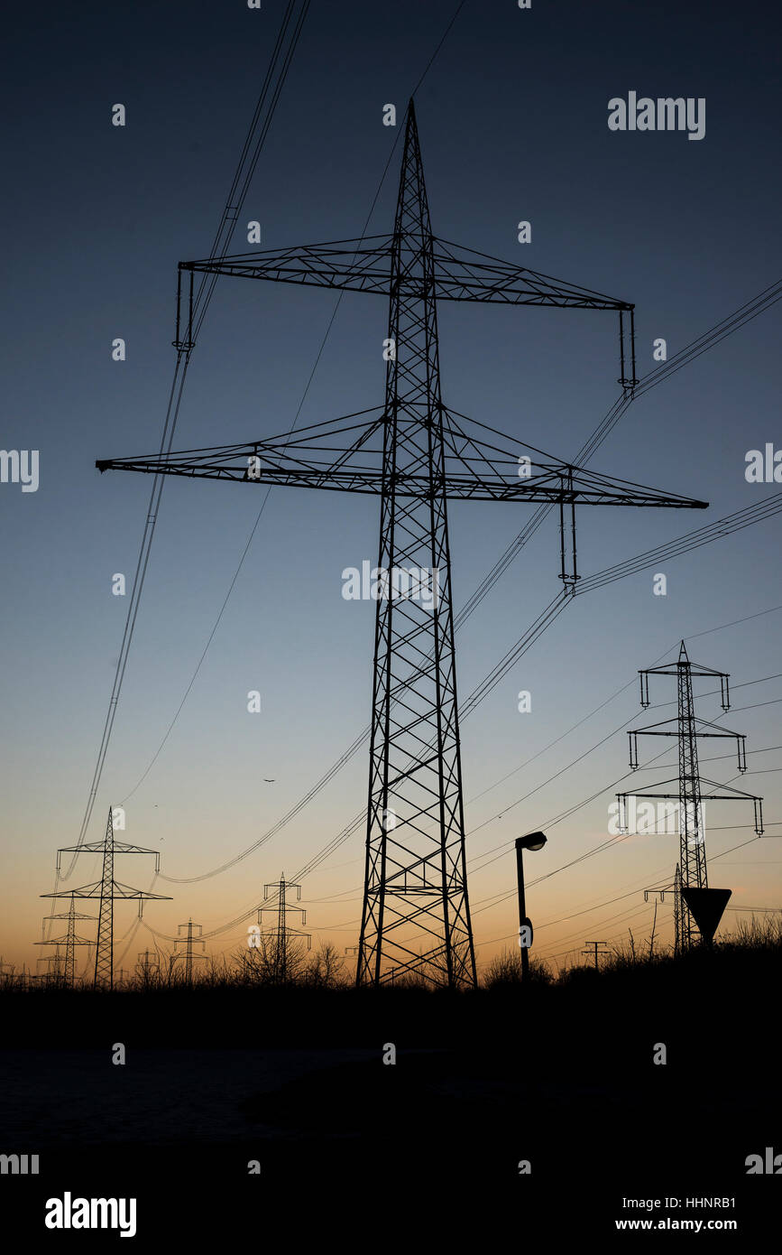 Electric power lines steel tower in landscape sunset sunrise dawn ...