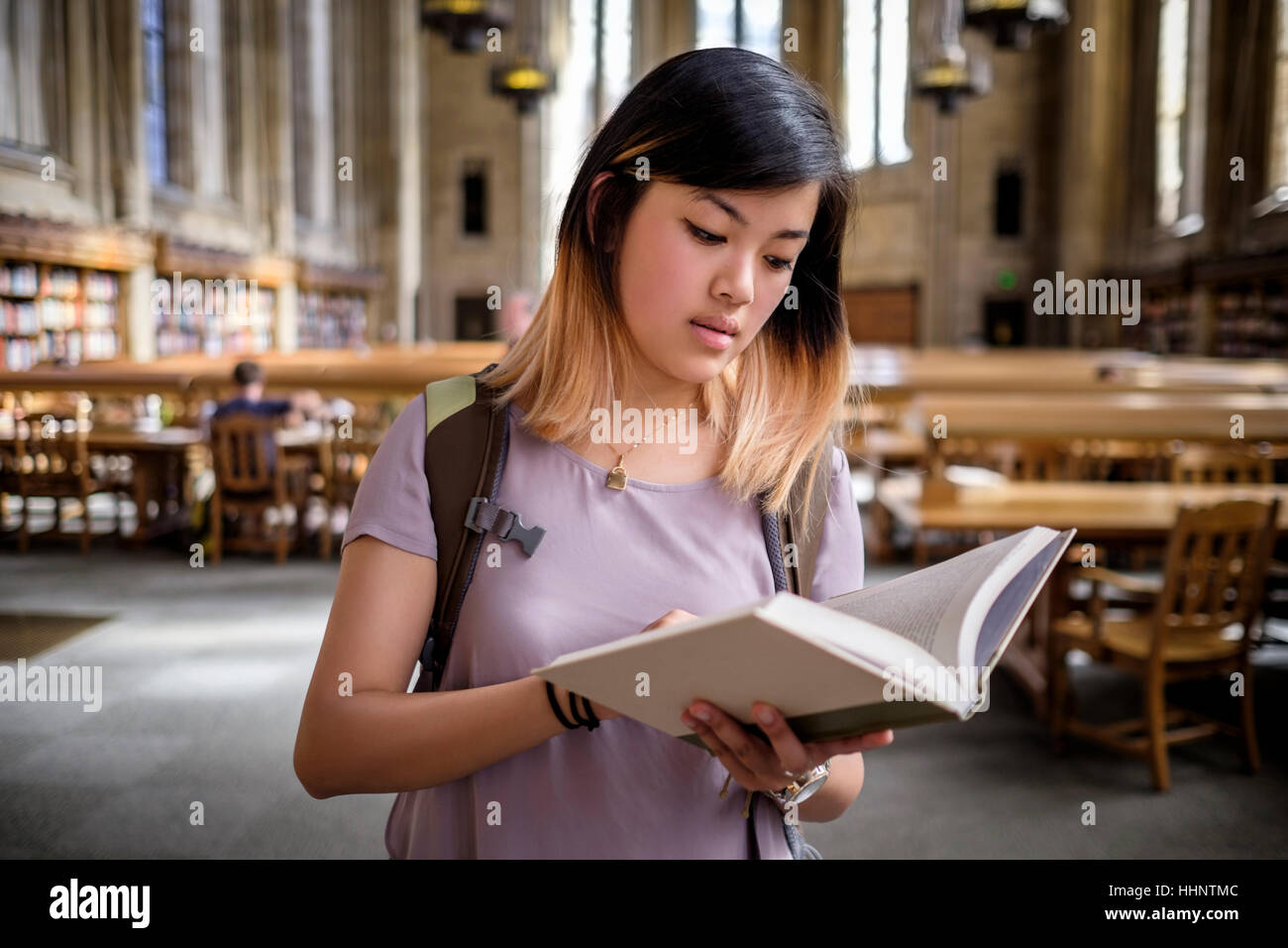 Reading standing up hi-res stock photography and images - Alamy
