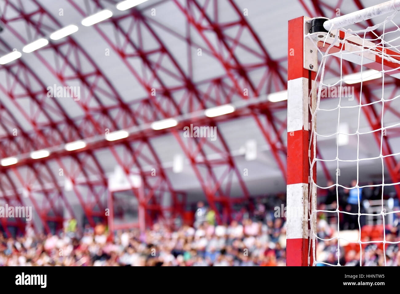 Handball goalpost and spectator crowd in the background Stock Photo - Alamy