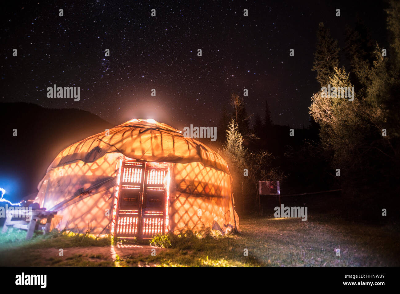 Shadows from bright glowing light inside yurt Stock Photo - Alamy