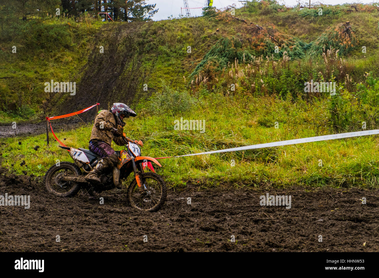 Caucasian racer on motorcycle spraying dirt Stock Photo - Alamy