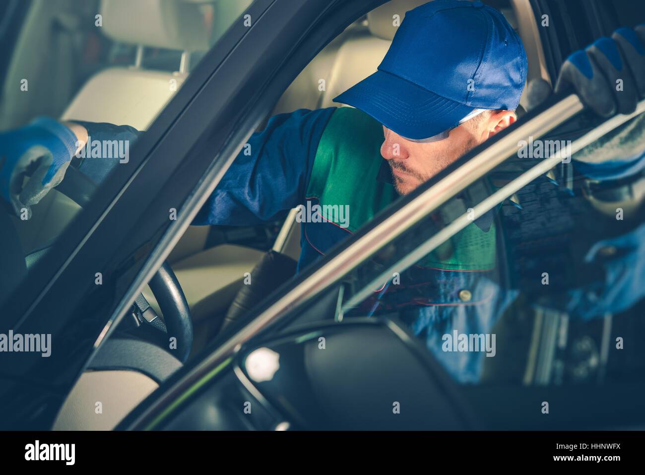 Car Mechanic Fixing Vehicle While Seating Inside the Car. Professional ...