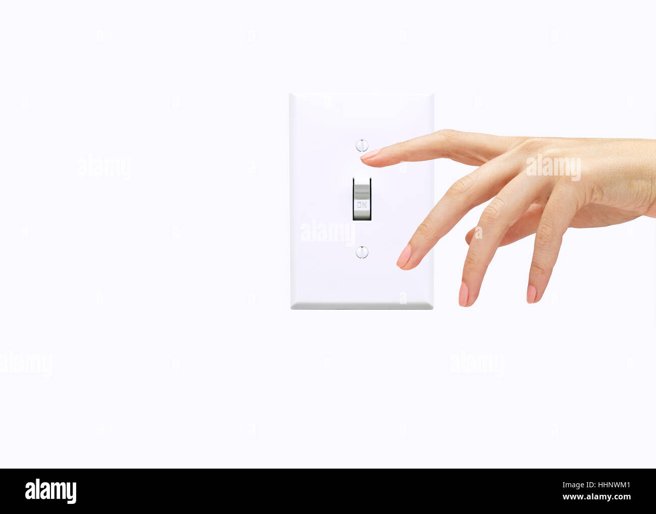 Hand of woman pressing light switch Stock Photo - Alamy