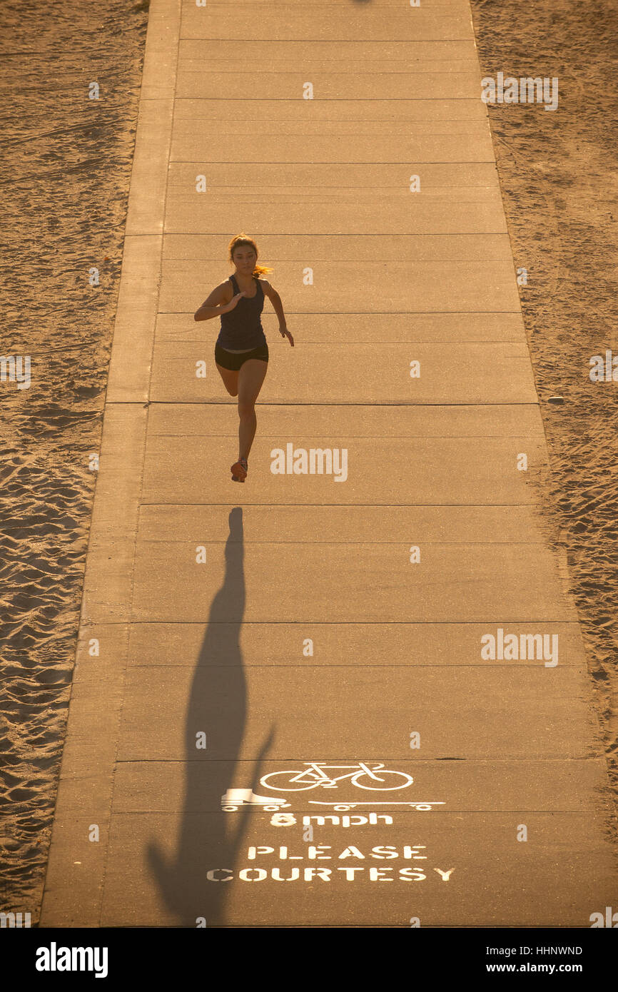 Running forward young woman hi-res stock photography and images - Alamy