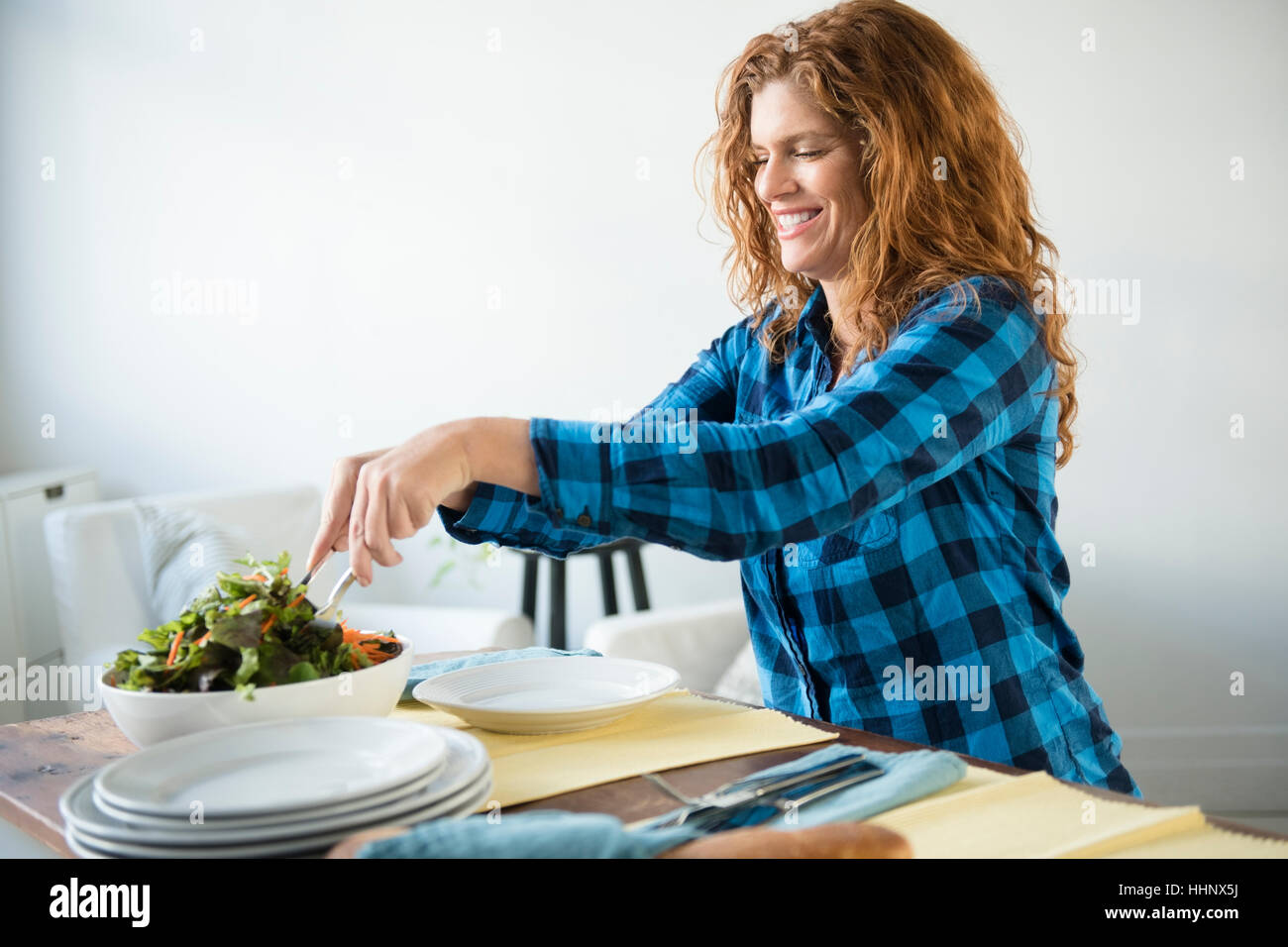 Woman serving salad hi-res stock photography and images - Alamy
