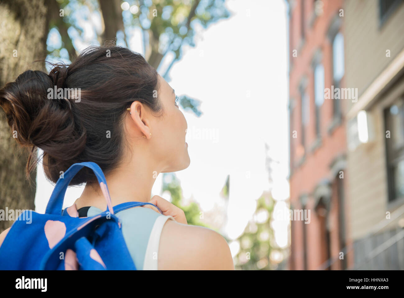Thai woman wearing backpack in city Stock Photo - Alamy