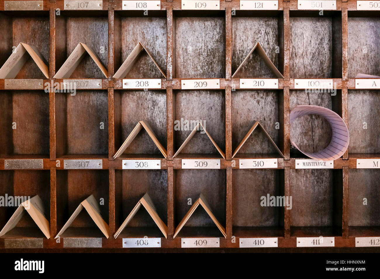 Messages in wooden slots in hotel Stock Photo - Alamy