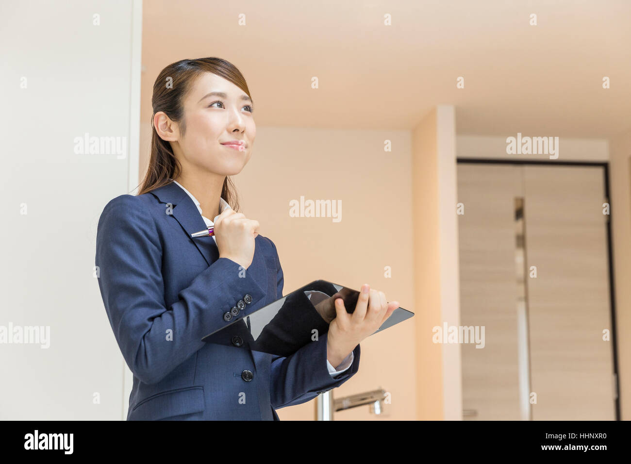 Real Estate Agent Taking Note on Floor Plan Stock Photo - Alamy