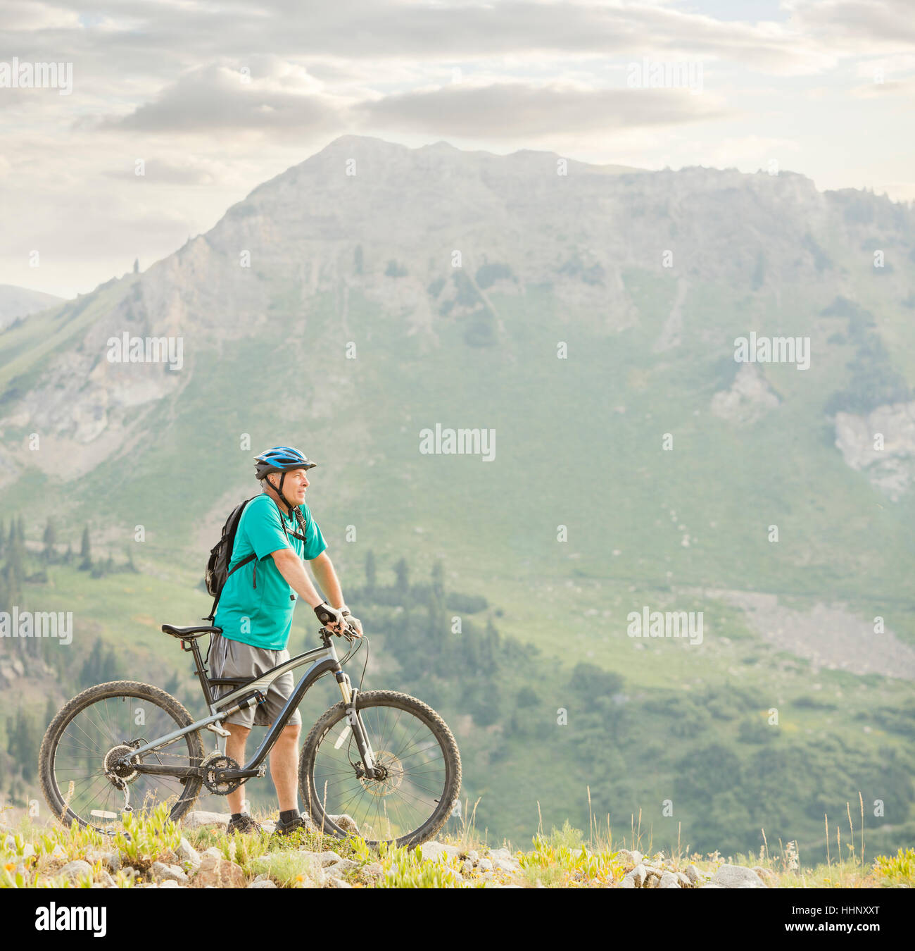 Caucasian man standing with mountain bike Stock Photo - Alamy