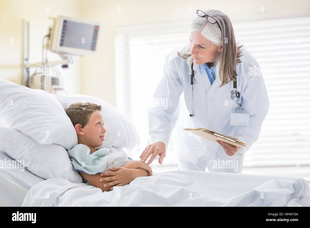 Boy sitting in hospital bed hi-res stock photography and images - Alamy