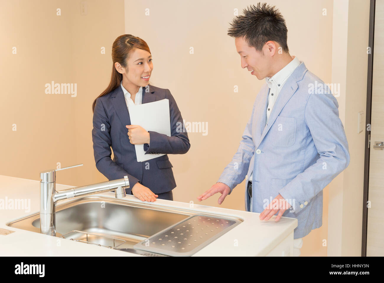Real Estate Agent Showing Room to Buyer Stock Photo - Alamy