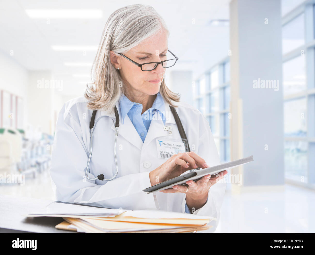 Healthcare professional reading online hi-res stock photography and ...