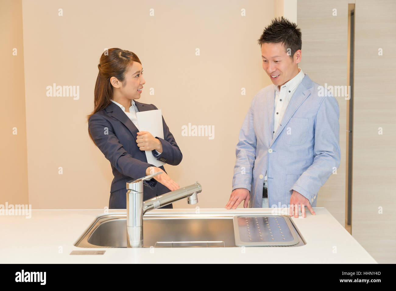 Real Estate Agent Showing Room to Buyer Stock Photo - Alamy