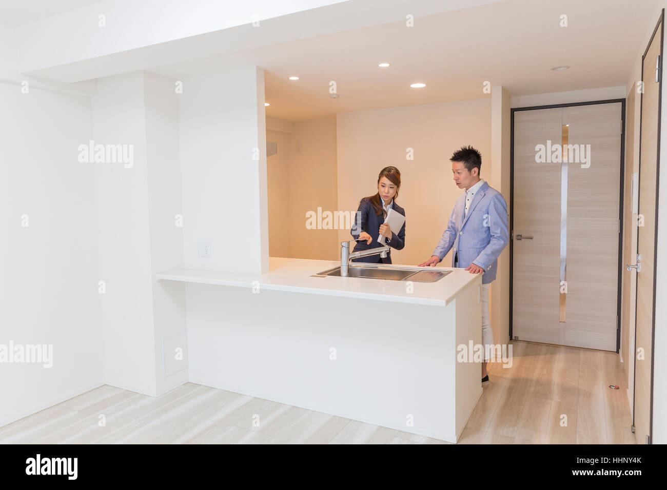 Real Estate Agent Showing Room to Buyer Stock Photo - Alamy