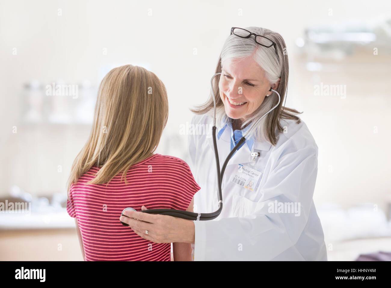 Doctor stethoscope examining girl hi-res stock photography and images ...