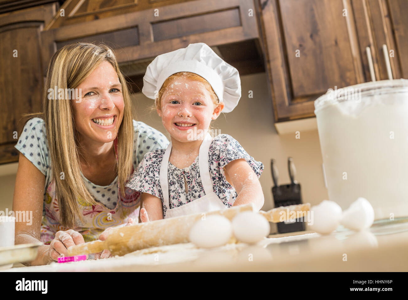 Caucasian mother and daughter covered in flour from food fight Stock ...