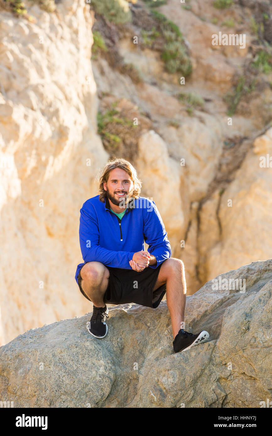 Man kneeling hands on stone hi-res stock photography and images - Alamy