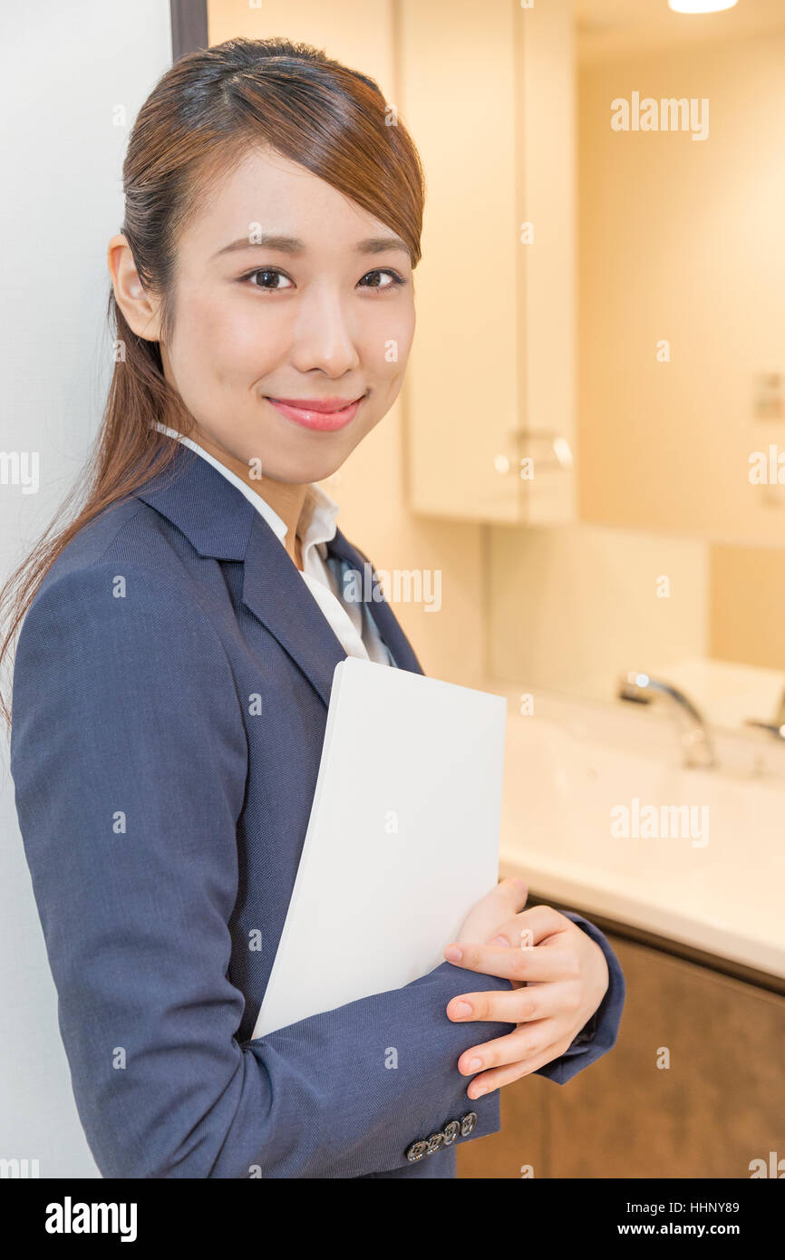 Real Estate Agent Showing Bathroom to Buyer Stock Photo - Alamy