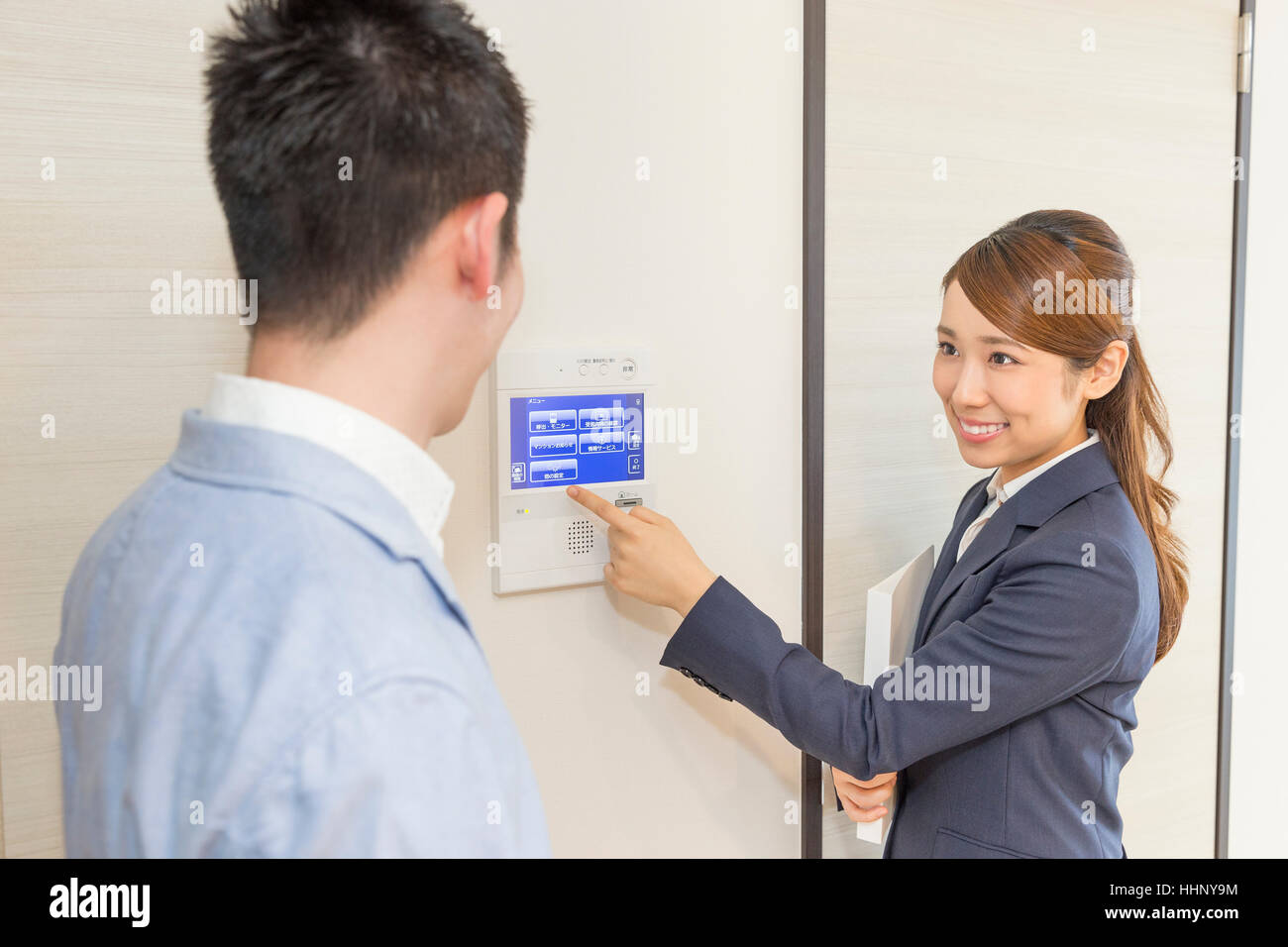 Real Estate Agent Showing Room to Buyer Stock Photo - Alamy