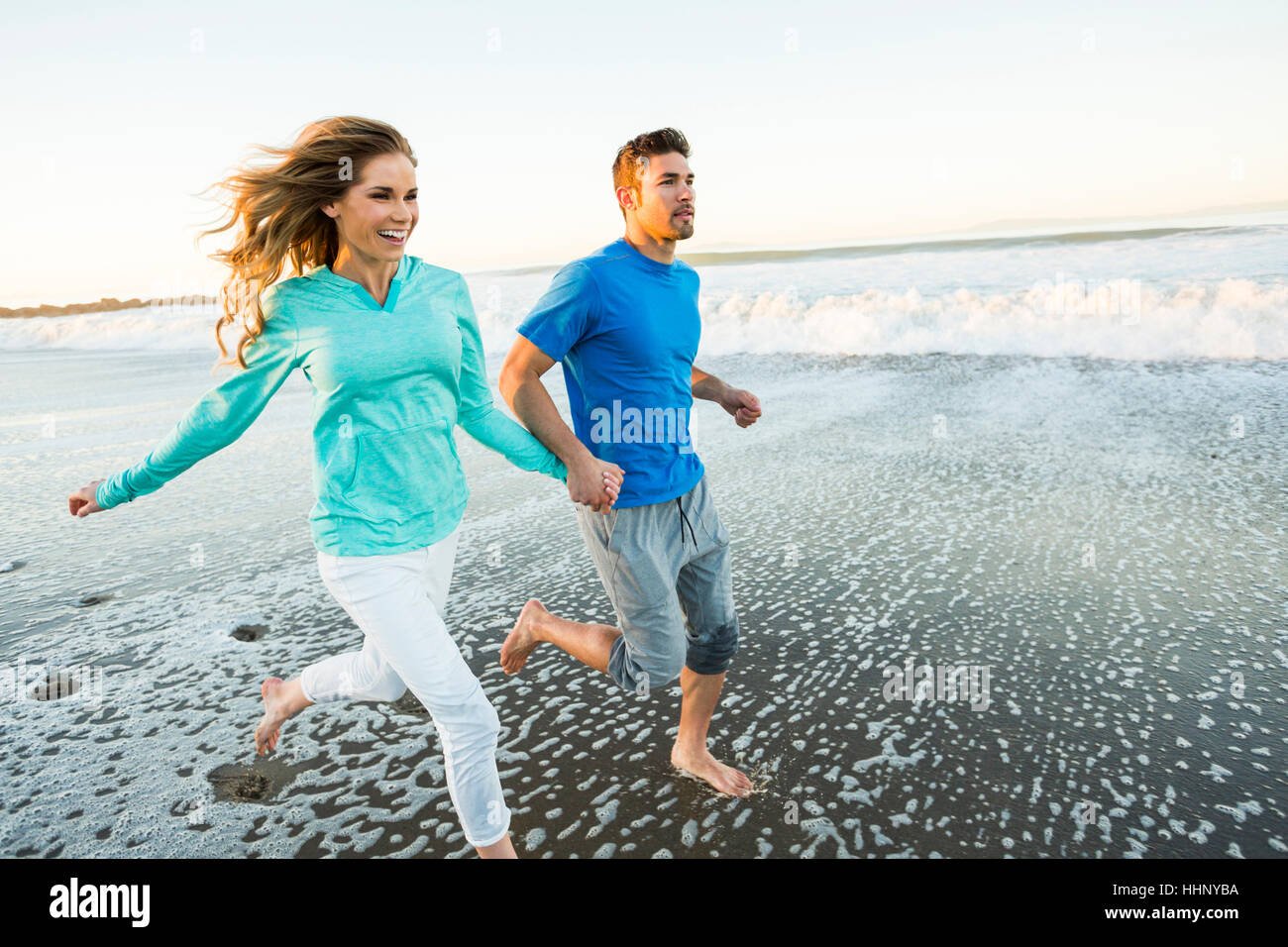 Two women running away hi-res stock photography and images - Alamy