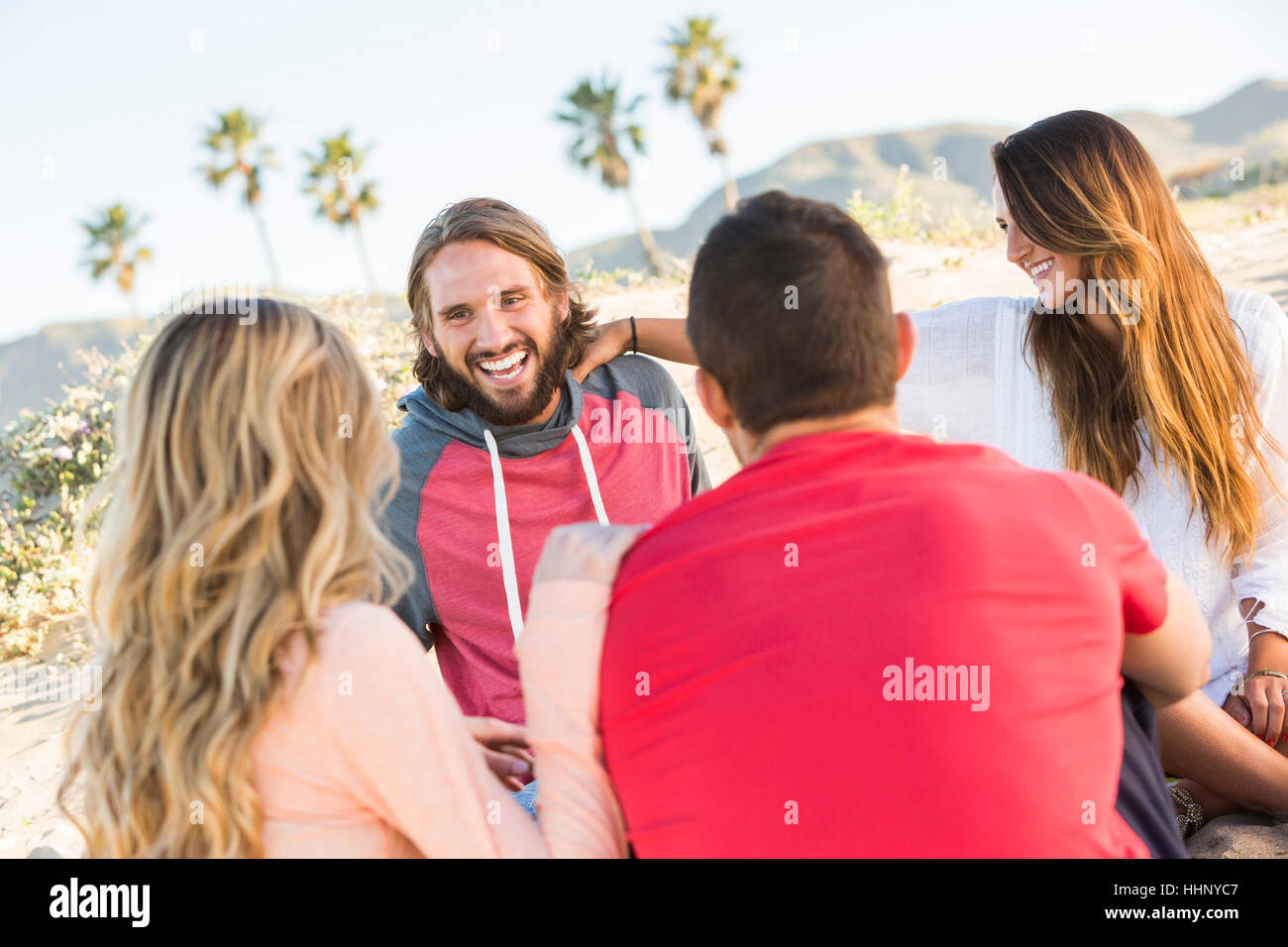Friends laughing at beach Stock Photo - Alamy