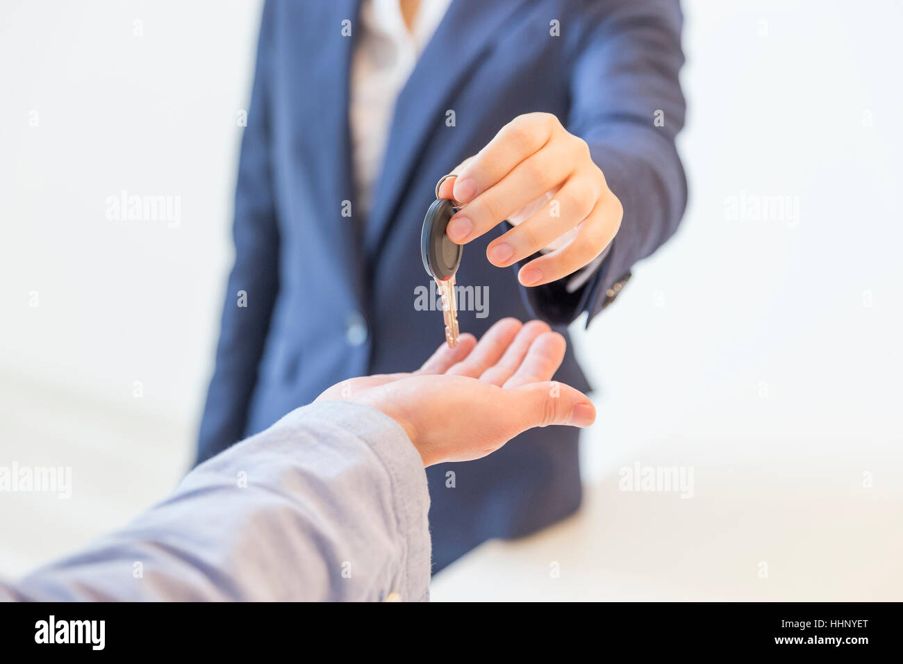 Woman Handing Key over to A Man Stock Photo - Alamy