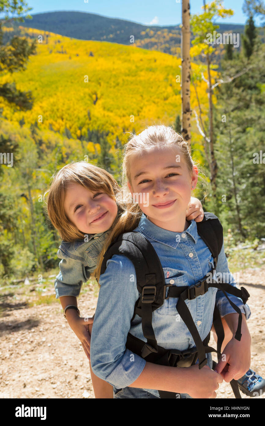 Sister carrying brother hi-res stock photography and images - Alamy