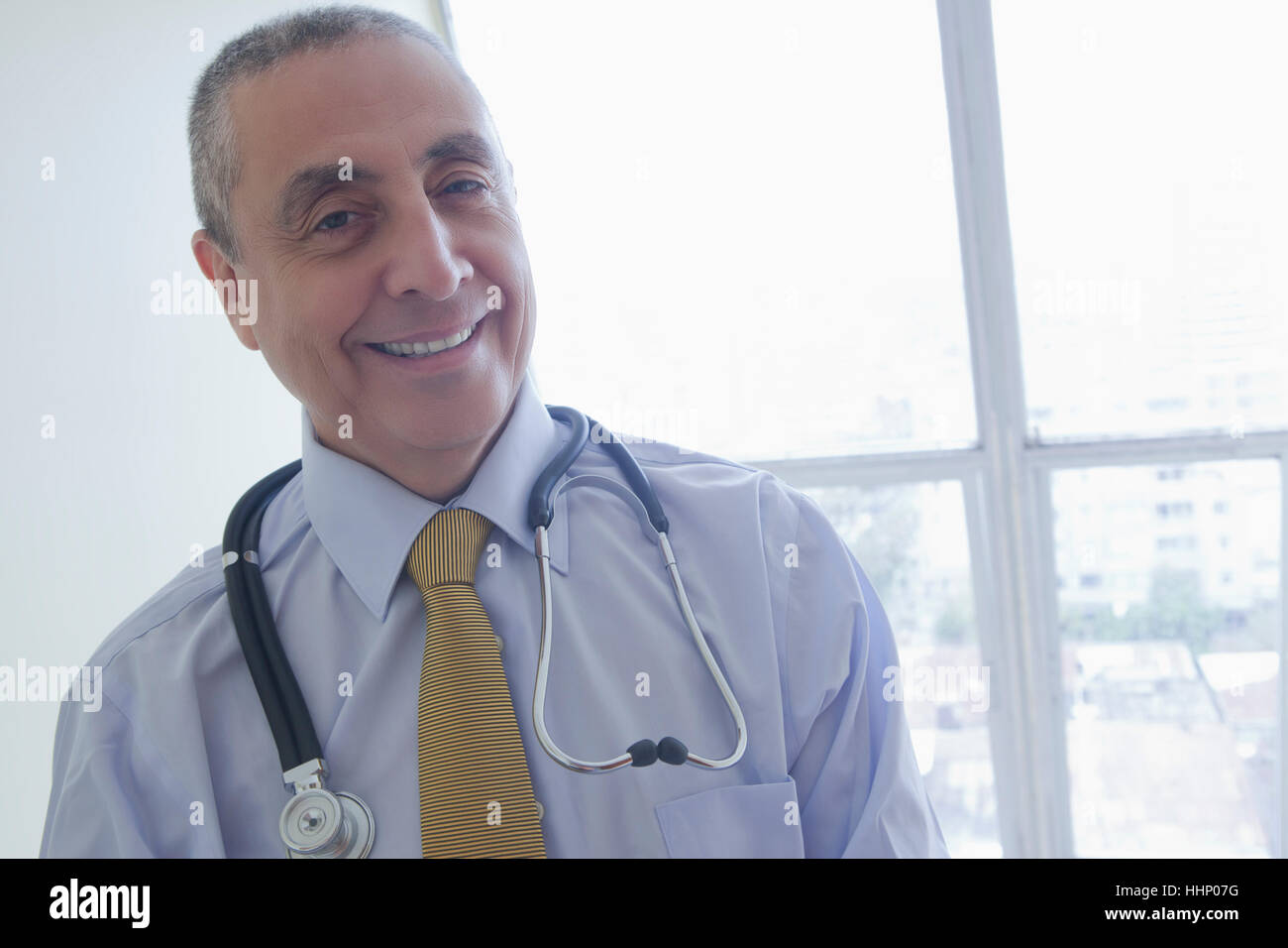 Smiling Hispanic doctor Stock Photo - Alamy