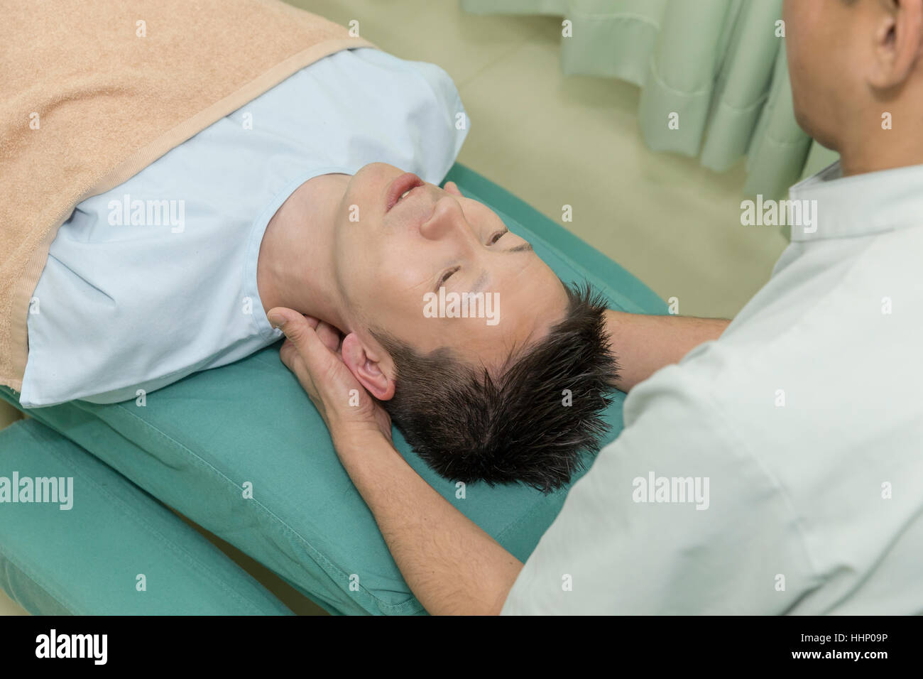 Neck Manipulation High Resolution Stock Photography and Images - Alamy