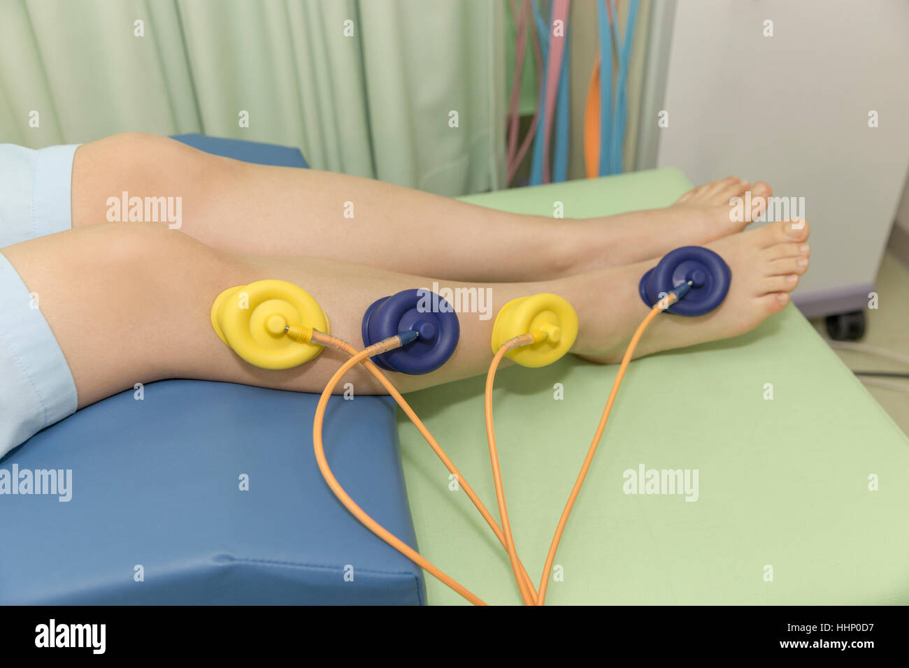 Legs Electrotherapy Performed by Doctor Stock Photo - Alamy