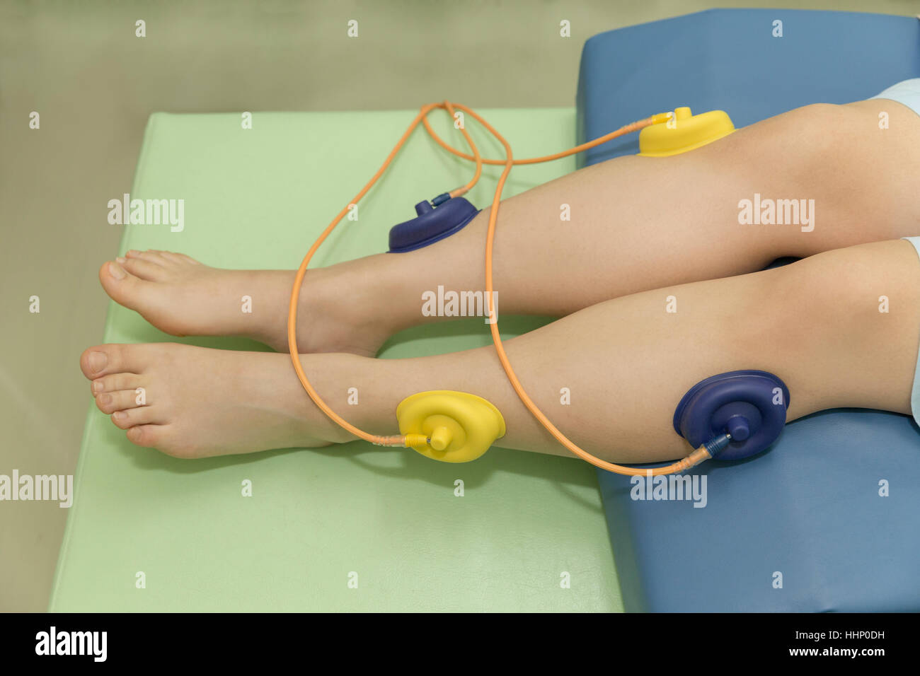 Legs Electrotherapy Performed by Doctor Stock Photo - Alamy